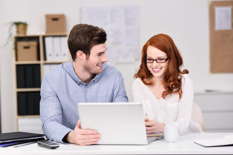 28 Signs A Female Coworker Likes You And What To Do