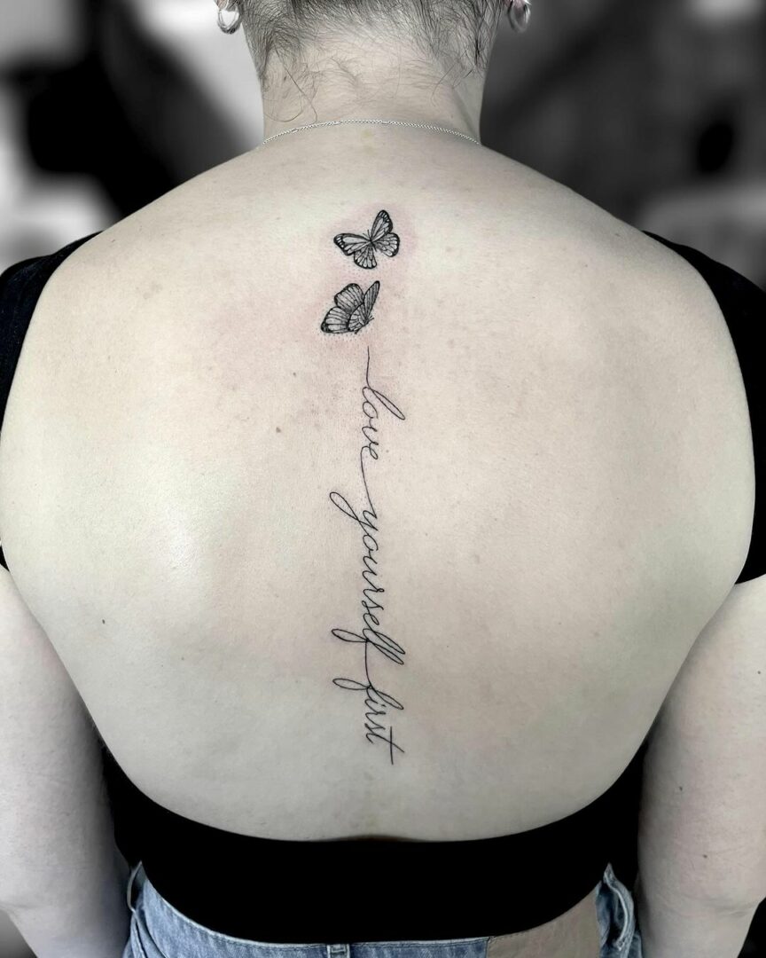 24 Cursive-Style Spine Tattoo Ideas From Delicate To Sassy