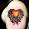 These 19 Heart With Wings Tattoo Designs Will Make Your Love Soar