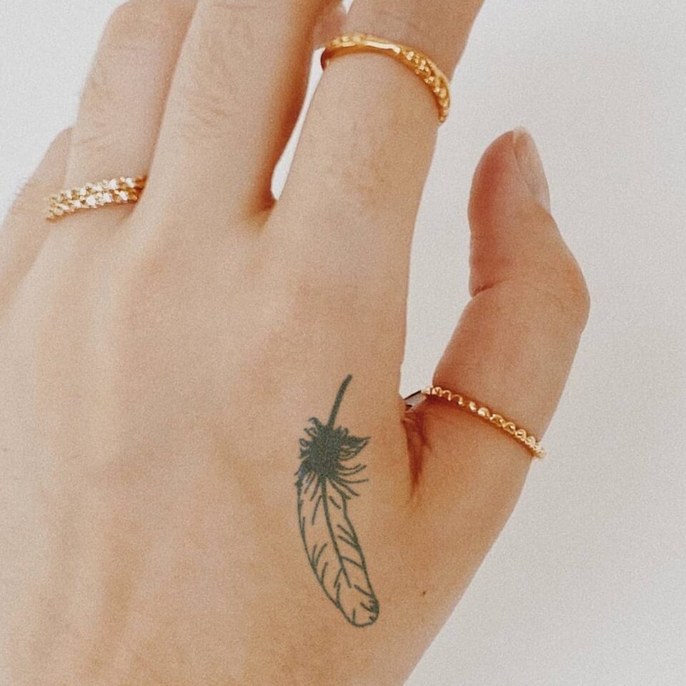 20 Epic Feather On Finger Tattoo Ideas To Wear Like A Ring