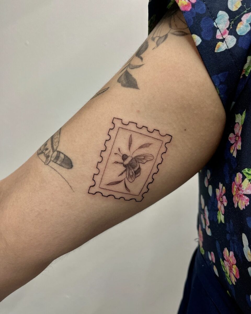 20 Lighthearted Stamp Tattoo Ideas For All The Dreamers Out There
