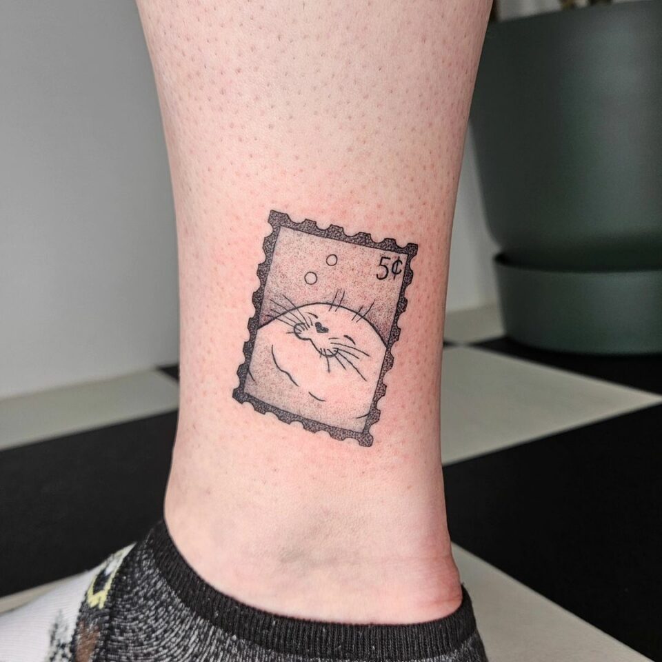 20 Lighthearted Stamp Tattoo Ideas For All The Dreamers Out There